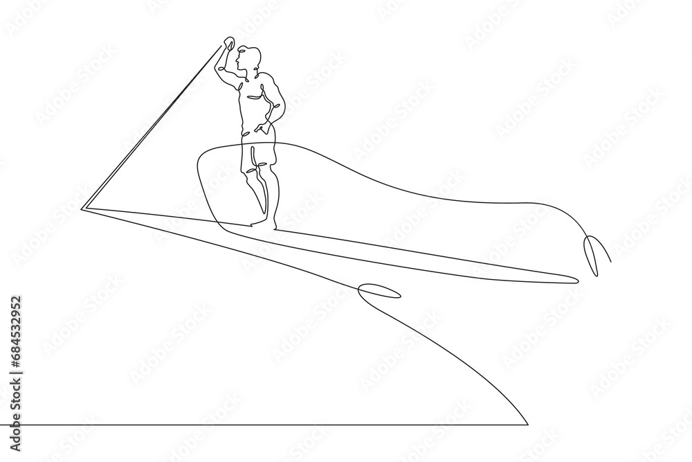 A young man stands on the bow of the ship. Man on the deck of a yacht ...