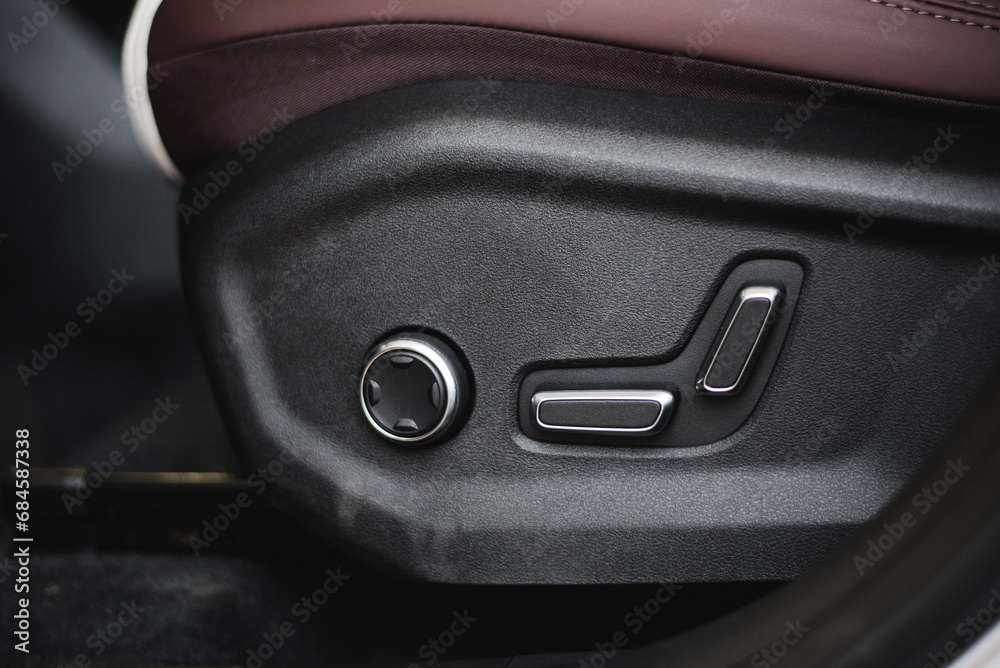 Mechanical levers at side of driver's seat for adjusting position ...