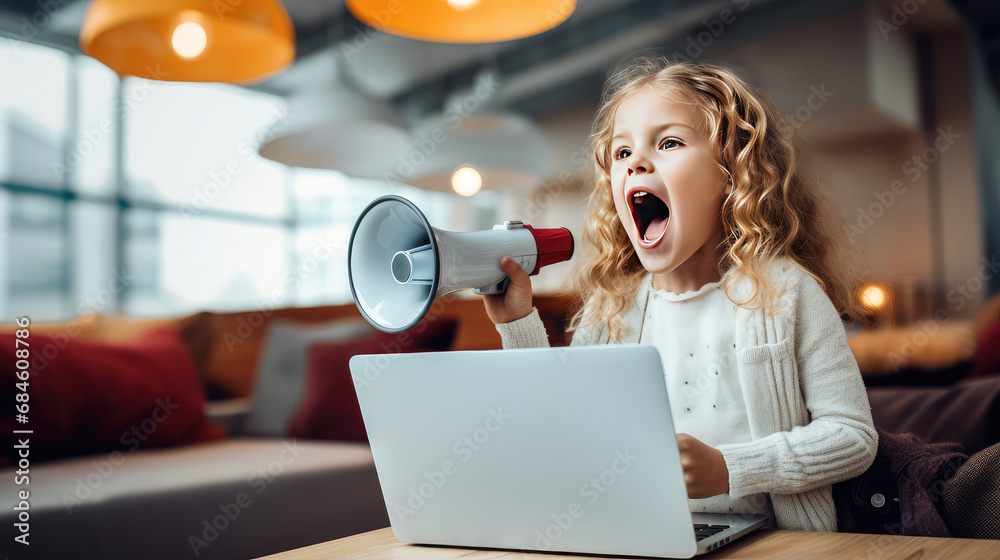 Girl child sit at her laptop and yells into a megaphone. Distance ...