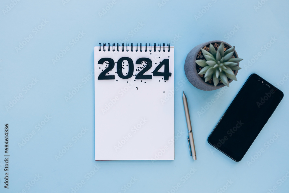 New year resolutions 2024 concept. 2024 goals list with notebook, pen ...