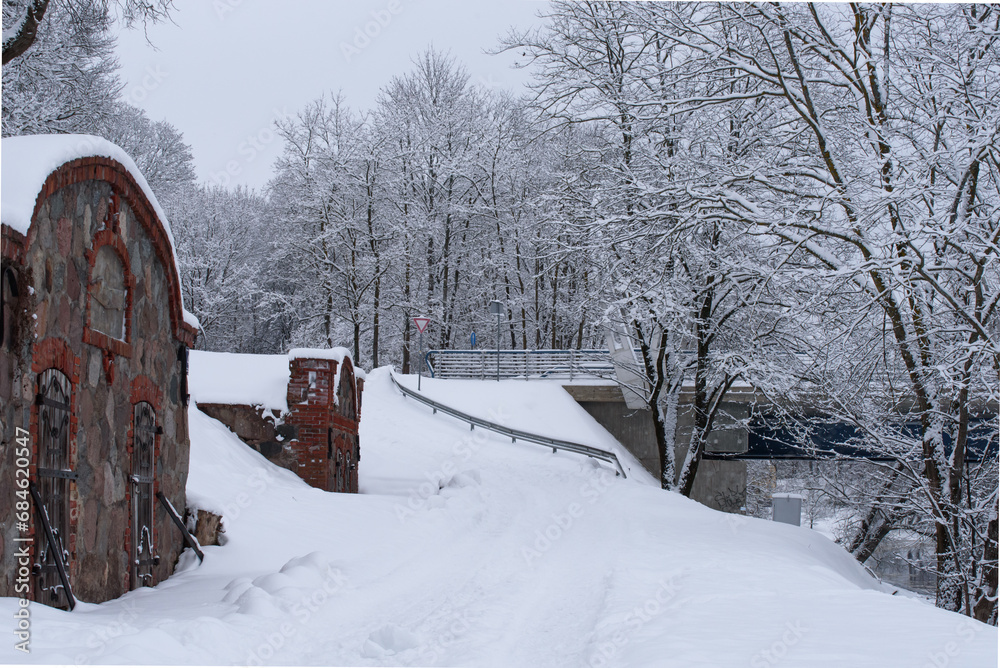 the warehouse cellars at the end of the bridge are covered with snow ...