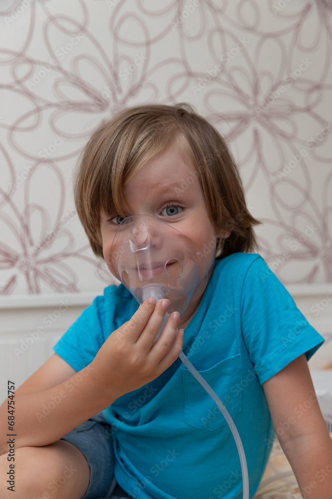 Blue-eyed boy being treated with nebulizer, child treating lungs ...