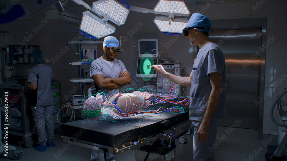 Foto de Diverse male surgeons in AR headsets work in operating room ...