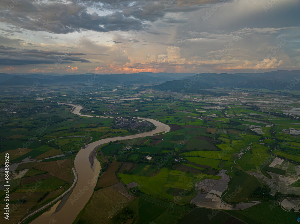 Farmland in riverside, paddy fields. Agricultural land of farmers. Blue ...
