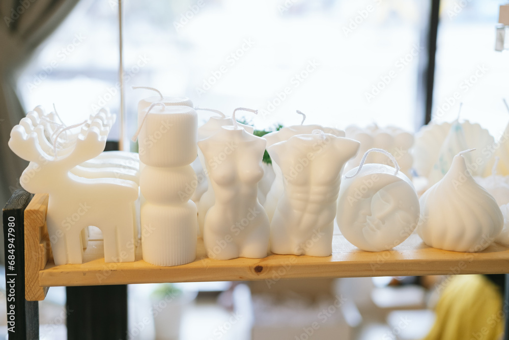 Group of soy candles in Venus body form, shell, deer, male body torso ...