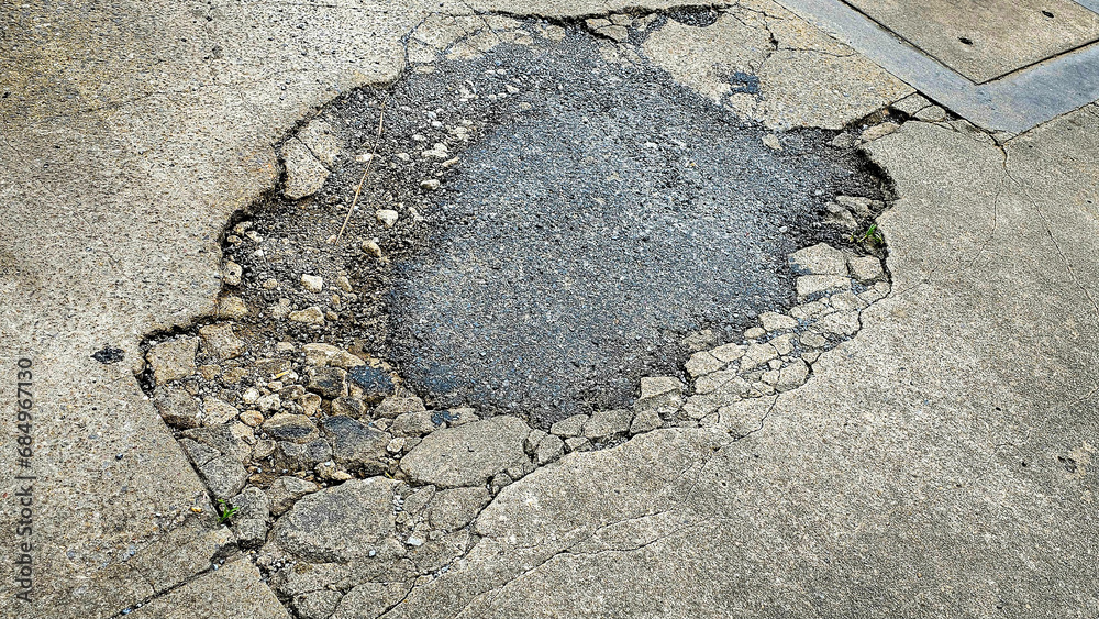 A picture of potholes at damage road, Damaged asphalt pavement road ...