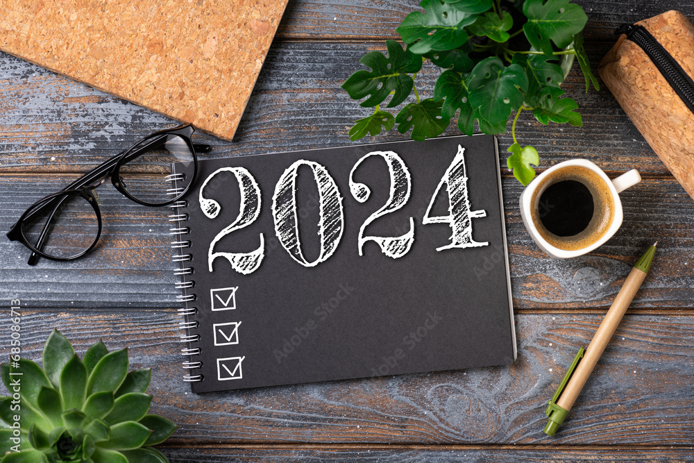 New year resolutions 2024 on desk. 2024 resolutions list with notebook ...