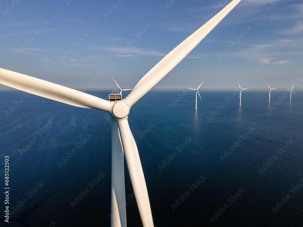Wind turbine from an aerial view, windmill farm in the lake IJsselmeer ...