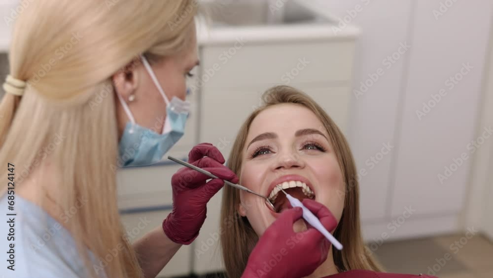 Female dentist, Oral examination, Dental doctor. Detailed inspection of ...