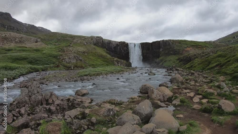 The Gufufoss waterfall is the largest in Seydisfjordur fjord, located ...