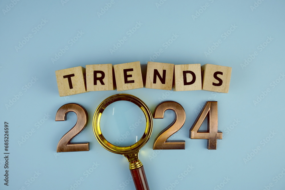 Trends of 2024 alphabet letters with magnifying glass on blue ...