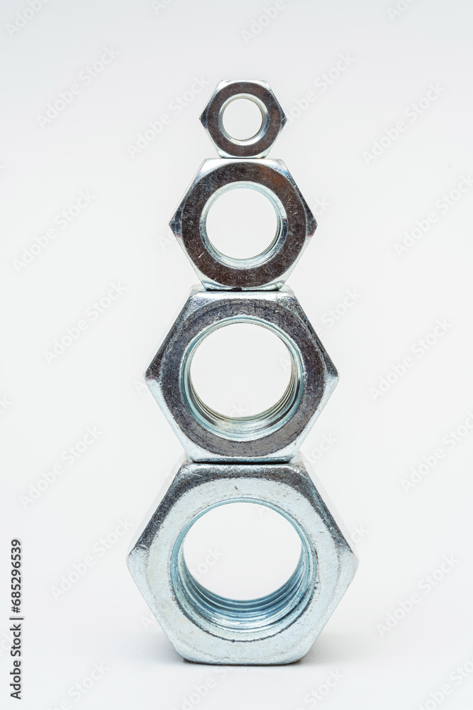 iron nut on a white background. metal nut on a light background. photos ...
