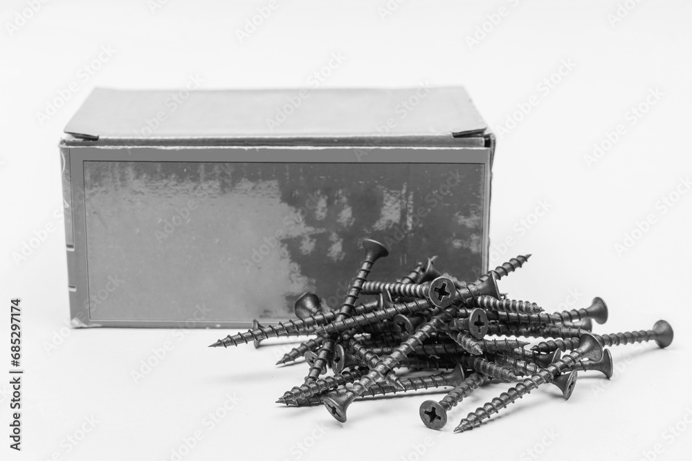 screws with packaging on a white background. photo of self-tapping ...