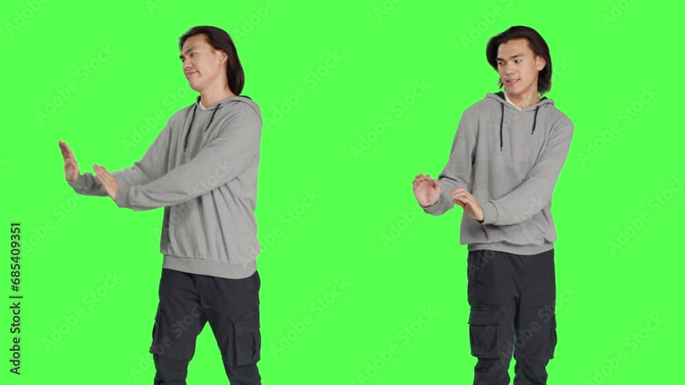 Vidéo Stock Male model pretending to push something aside, expressing ...