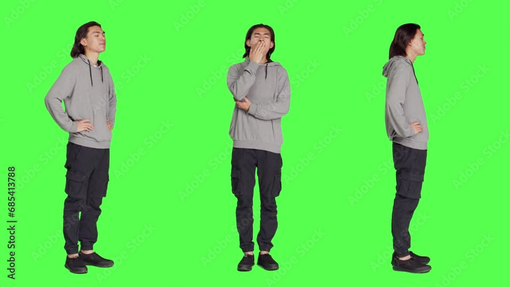 Young guy feeling sleepy and yawning after not getting enough sleep ...