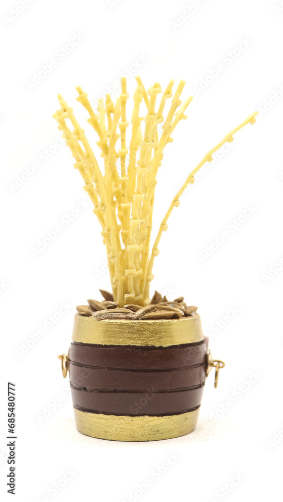 an offering to god with coconut flower in a vessel filled with wheat ...