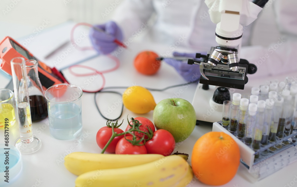 Scientist chemist studying amount of toxic substances in vegetables and ...