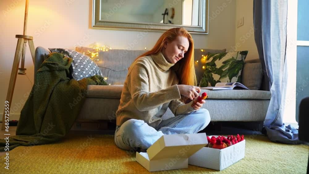 Young mother packing handmade gifts for her children for Christmas ...