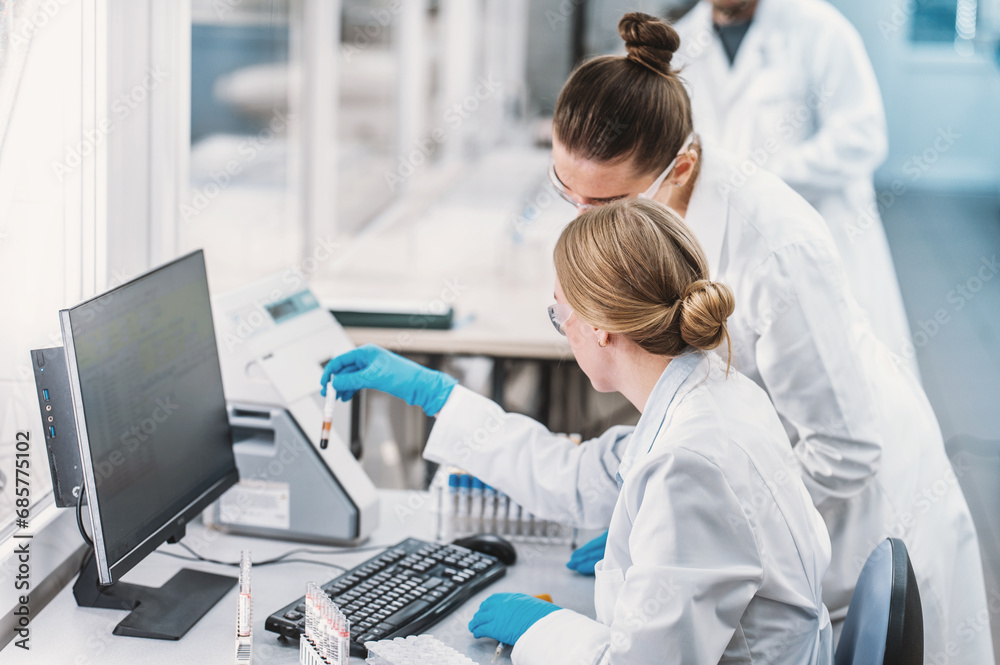 team of laboratory technicians conduct series of tests on chemical ...