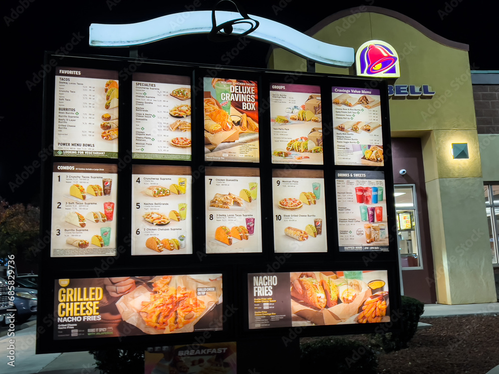 Screen showing menu at the entrance of a local Taco Bell restaurant ...