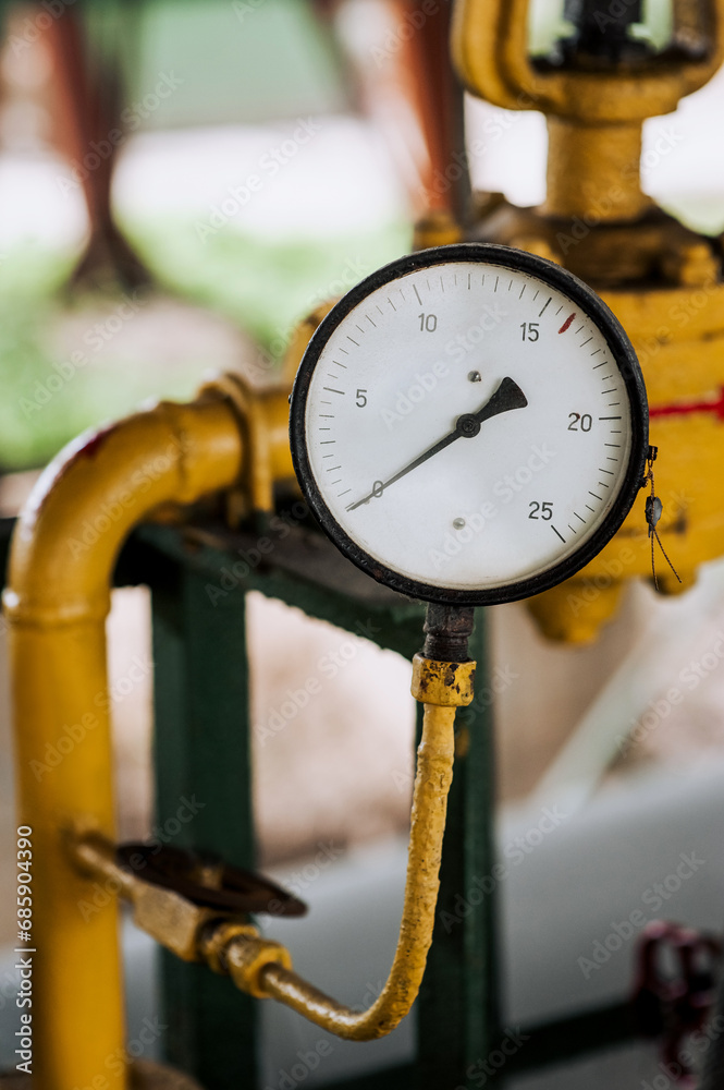 Industrial pressure gauge with a scale for measuring pressure in a gas ...