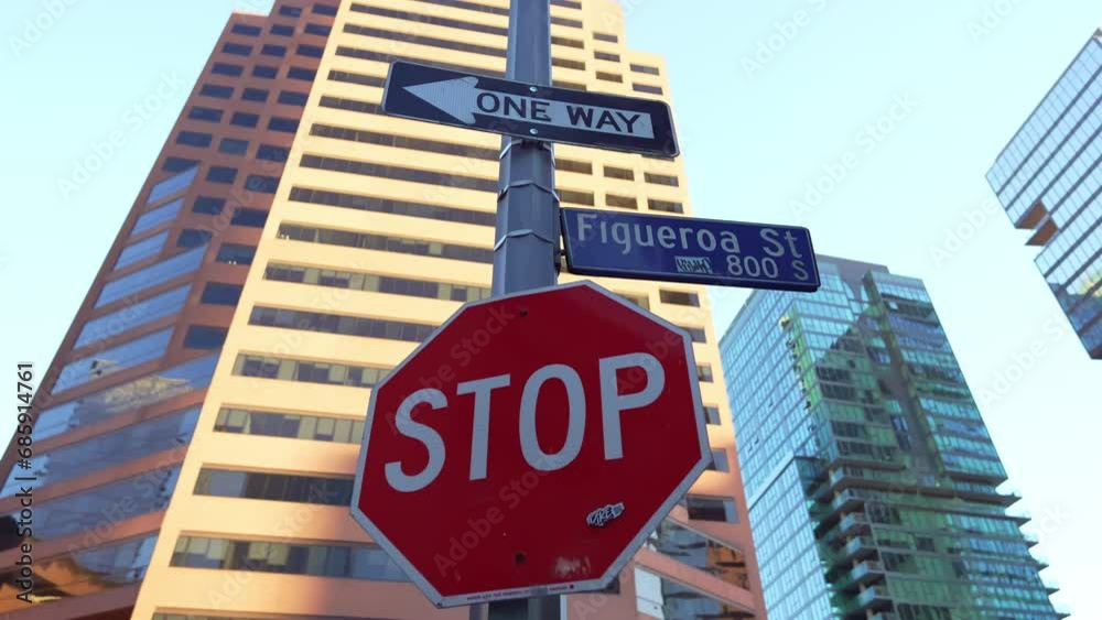 Road sign Figueroa St and Stop, One Way signs in Down Town with office ...