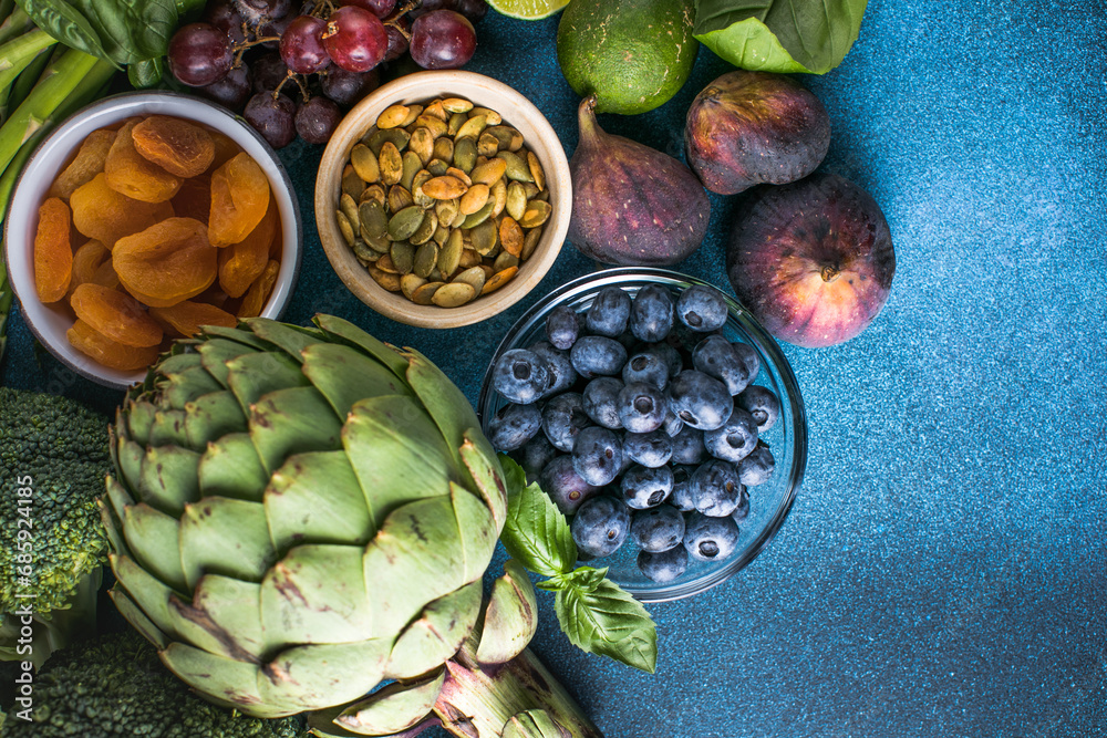 Variety of fresh raw organic fruits and vegetables. Health foods high ...
