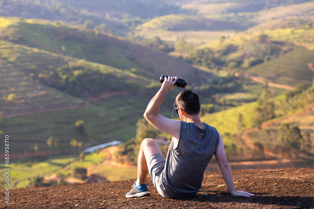 Brazilian man refreshes himself in the scorching heat by pouring water ...