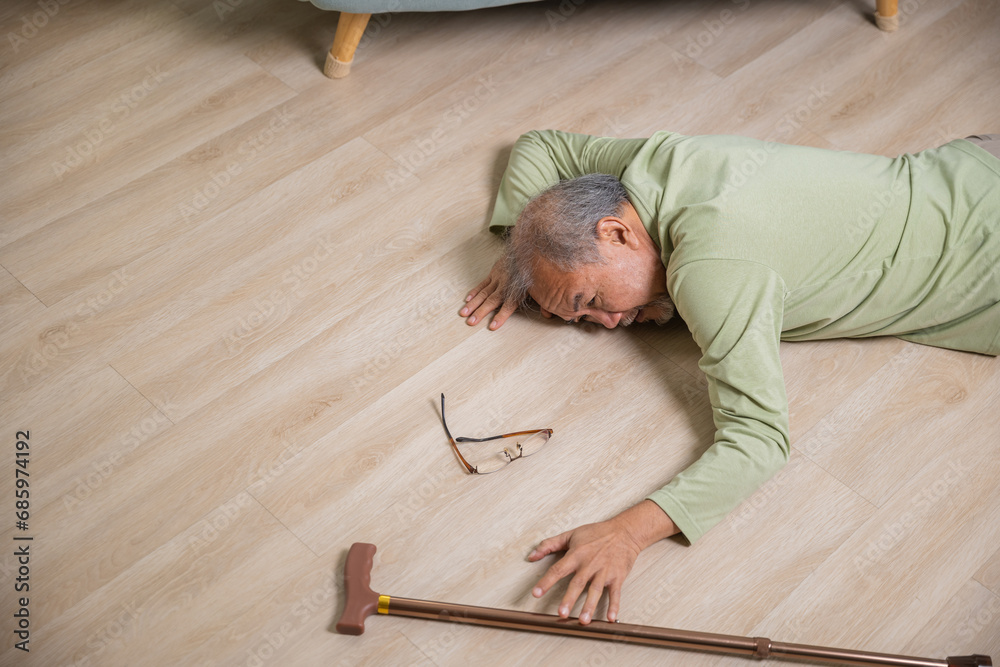 Older senior man headache lying on the floor after falling down he pain ...