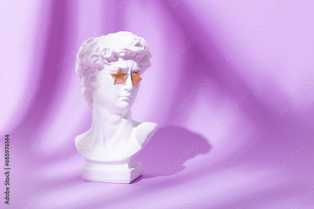 Fake sculpture of the head of David with gold stars in his eyes on a ...