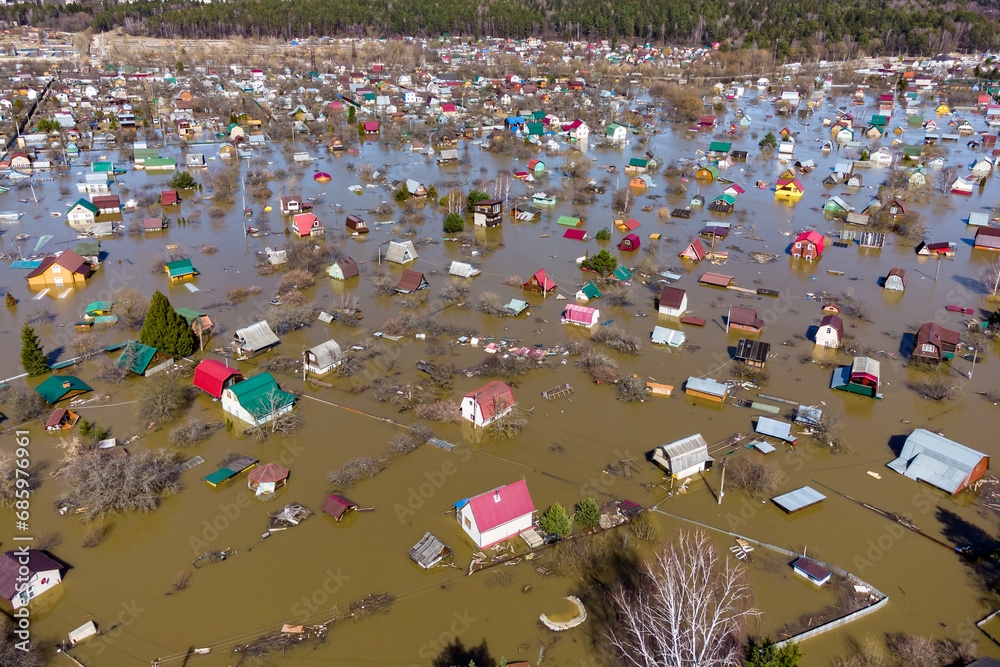 Private sector with small country houses flooded during the spring ...