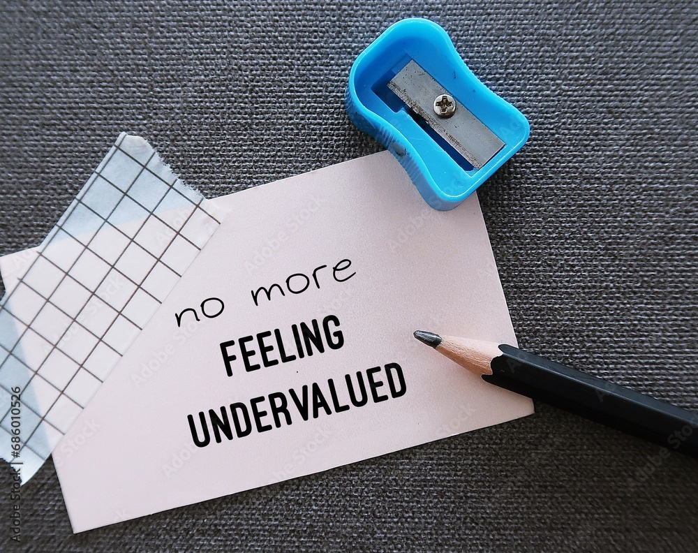Note with pencil writing No More Feeling Undervalued - to overcome ...