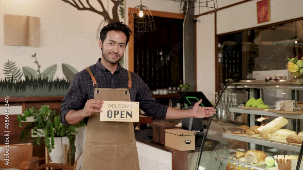 Young attractive Indian barista male cafe entrepreneur start-up holding ...