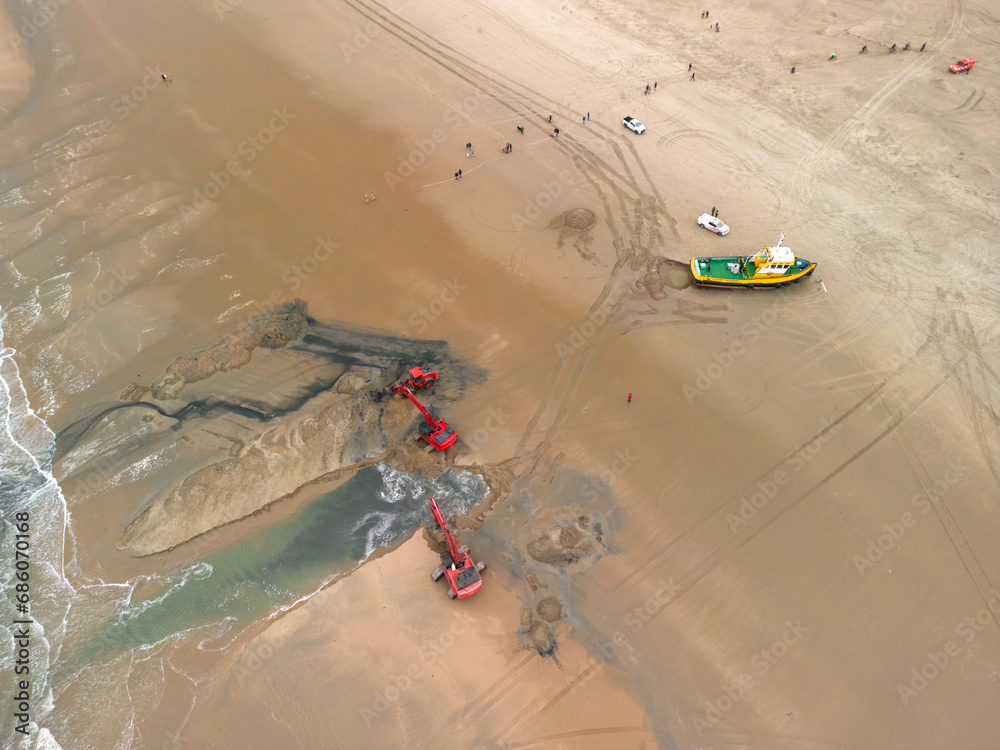 rescue of a ship, tug. The ship washed ashore during a large storm in ...