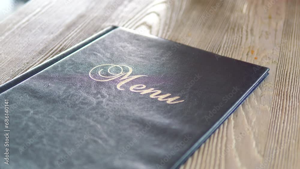 Waiter's Hand Professionally Presenting the Menu to Guests at a ...