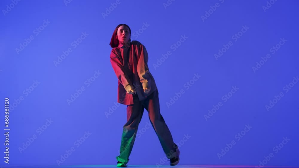 In the picture on an blue, light background. Dances young, beautiful ...
