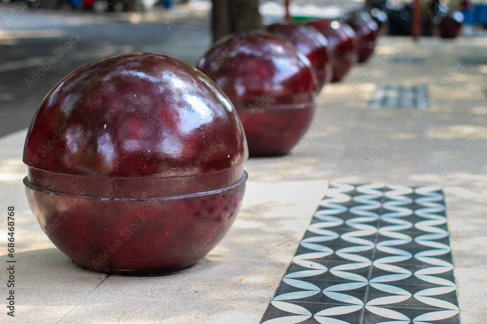 bollard ball barrier between road and sidewalk part of street furniture ...