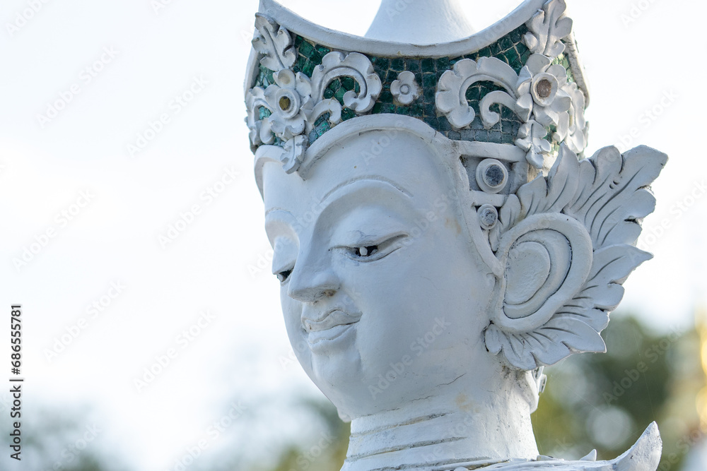 A large deity statue often stands out at the entrance to the Lanna ...
