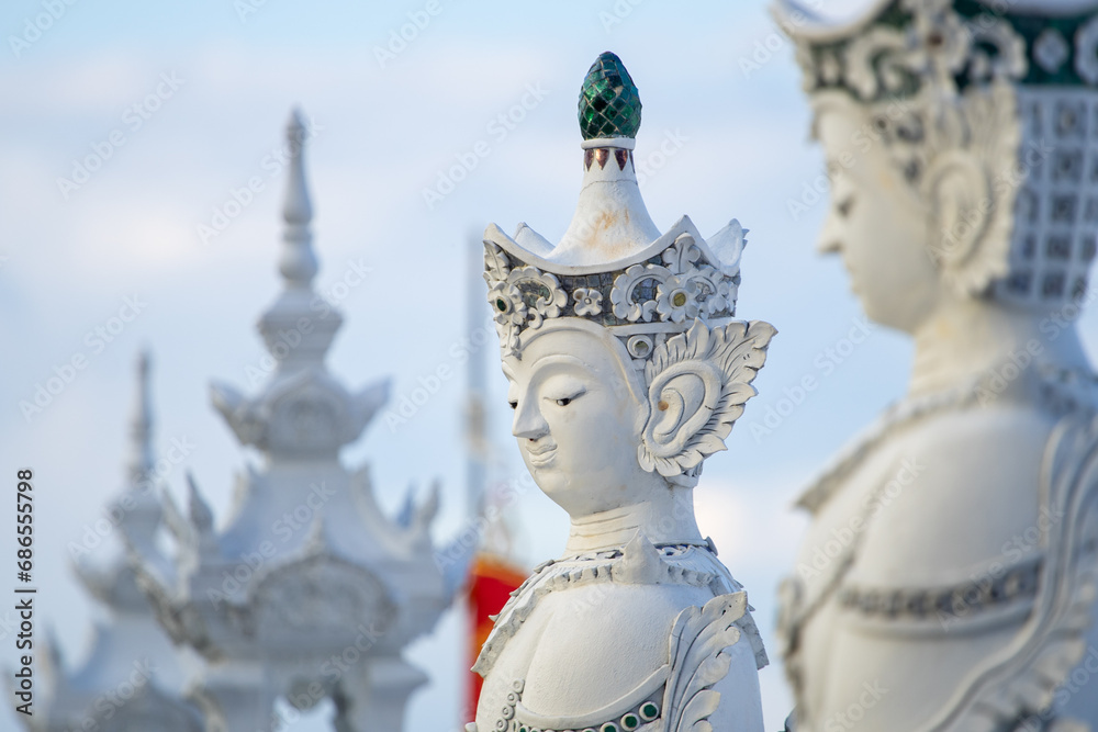 A large deity statue often stands out at the entrance to the Lanna ...