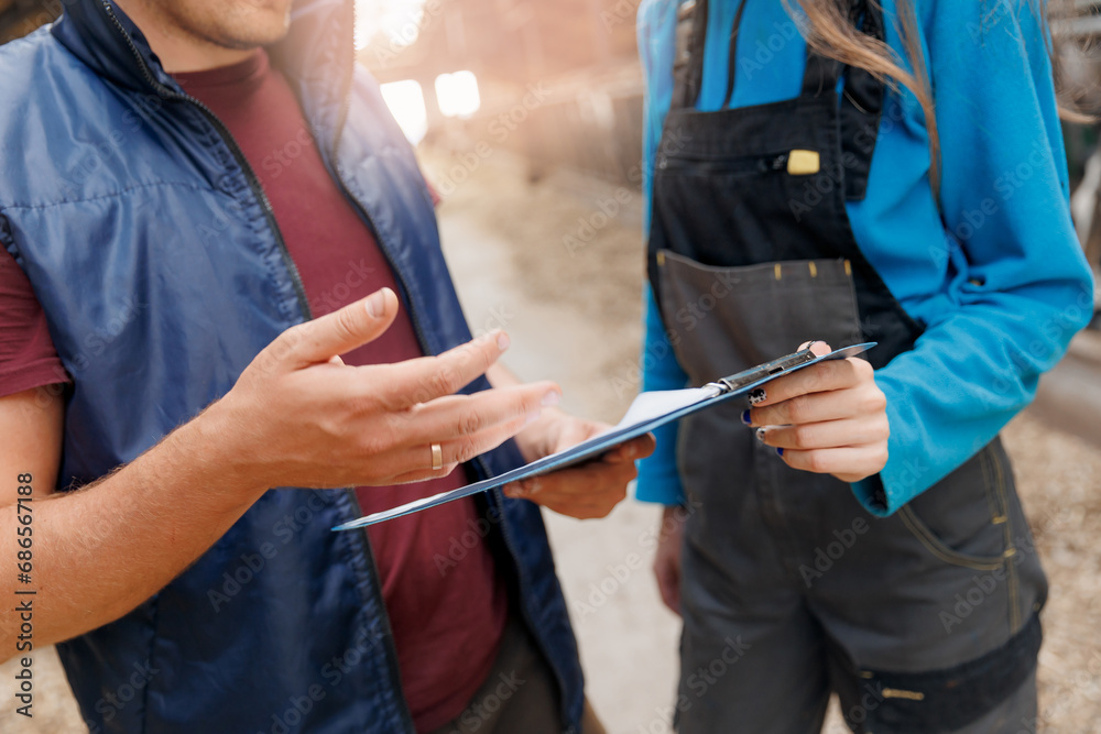 Young vet doctor female worker and man farmer discussing ...