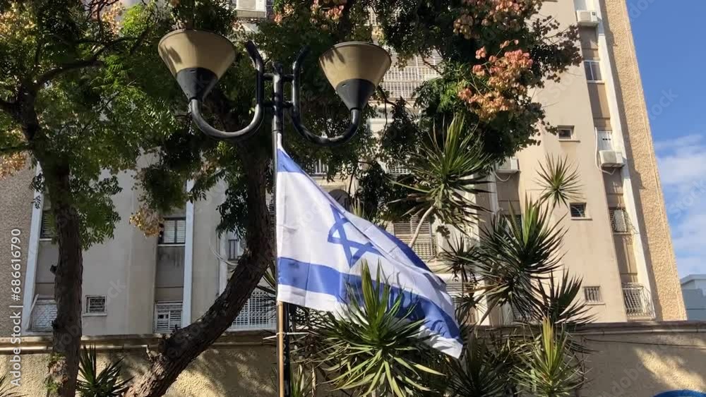 Residential area Gush Dan. Israeli flag in the wind near a residential ...