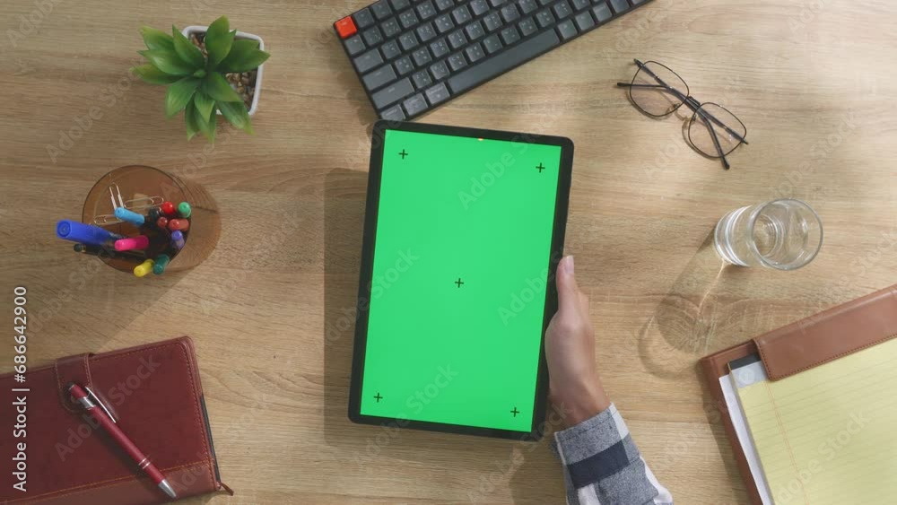 Top Down View Of Man'S Hand Holding A Tablet With Mock Up Green Screen ...