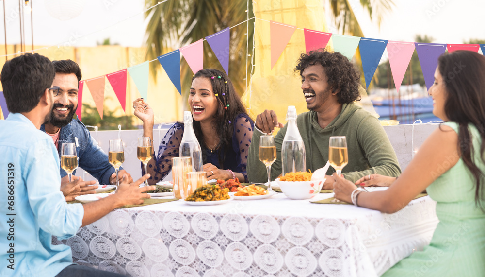 Group of Friends having fun together during evening dinner party on ...