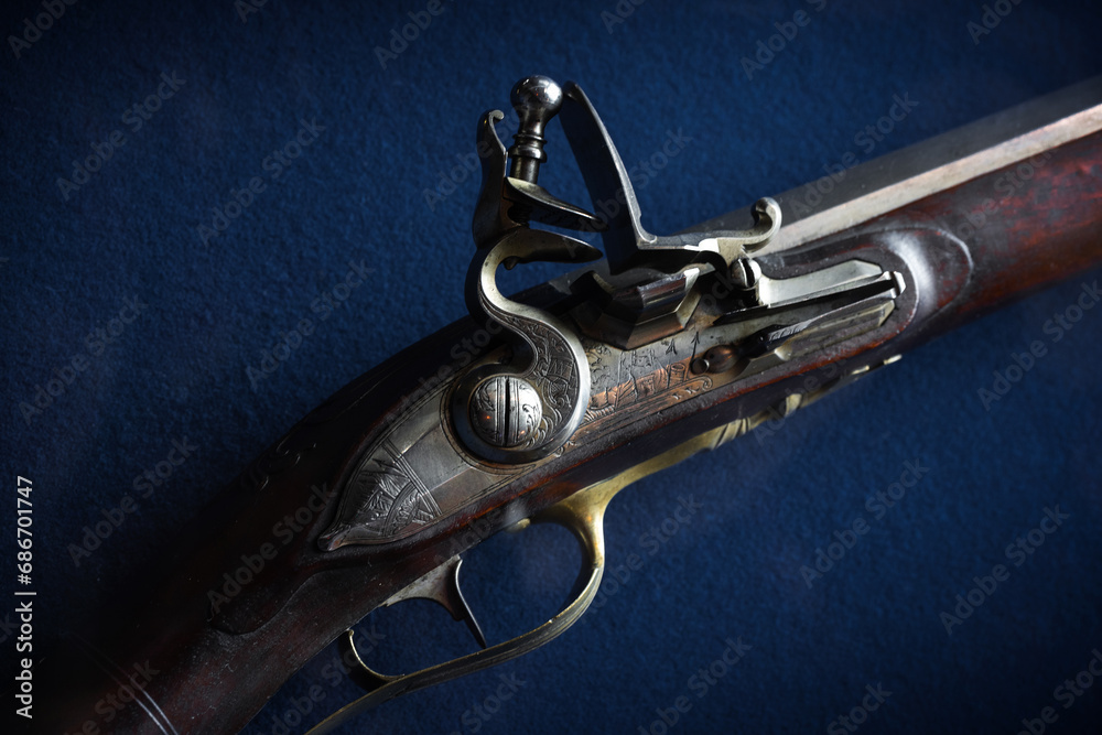 Photo & Art Print Flintlock of an 18th-century rifle over deep blue ...