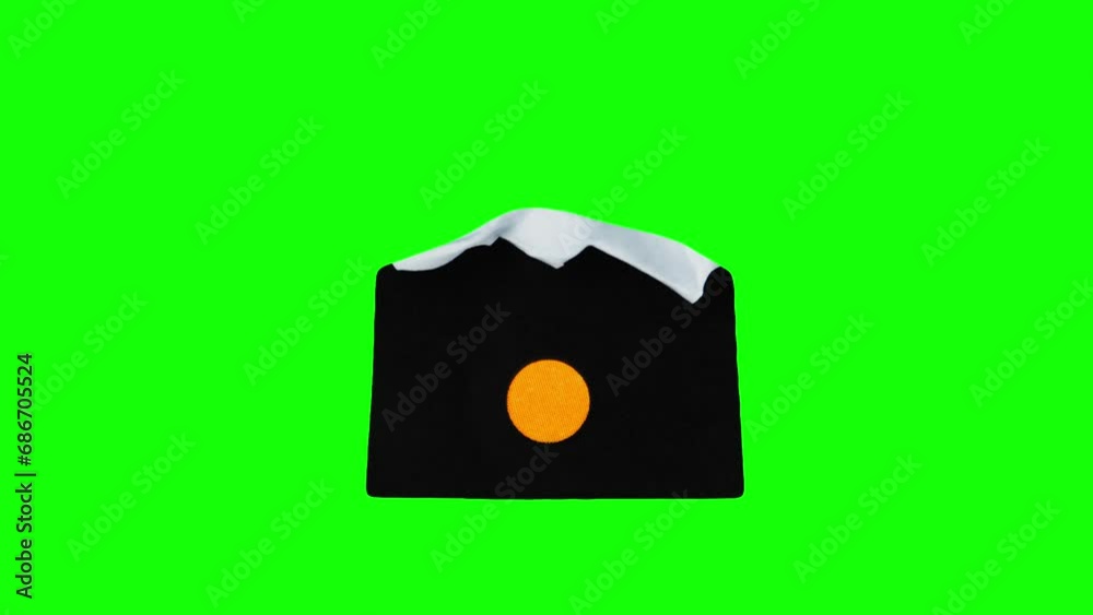 Full stop punctuation symbol on black piece of crumpling and unwrapping ...