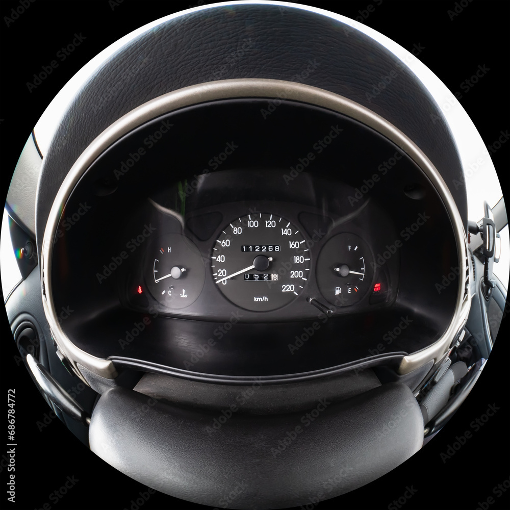 Dashboard in a car. Wide-angle view of the speedometer from the driver ...