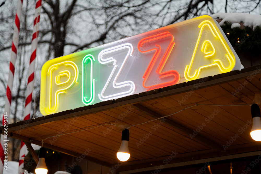 Street neon sign inscription pizza lit with Italian flag colors ...