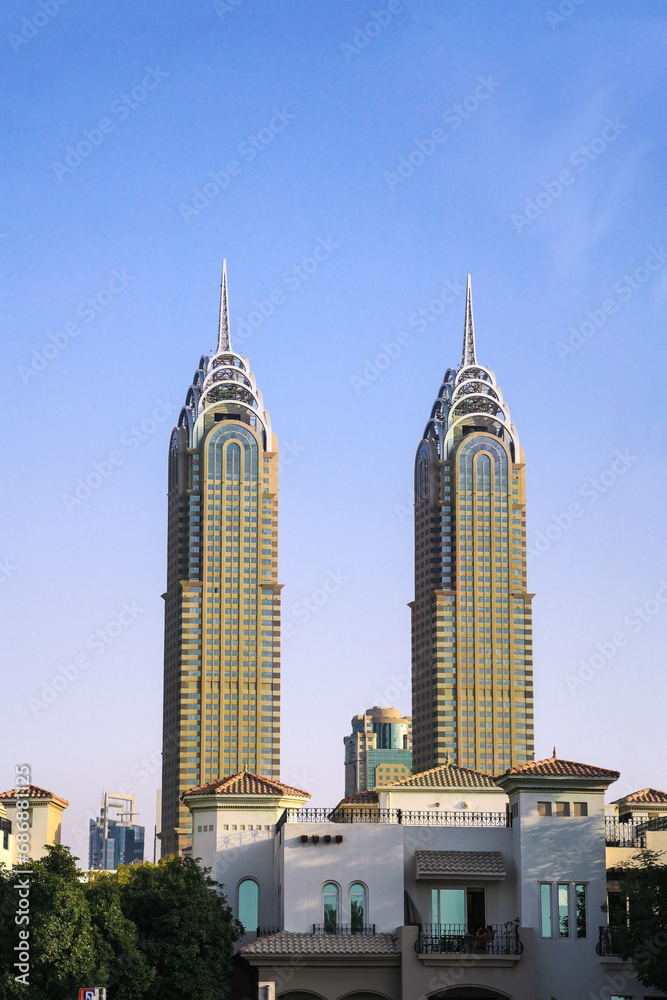 Dubai, UAE - February 23. 2022: The Al Kazim Twin Towers agaist blue ...