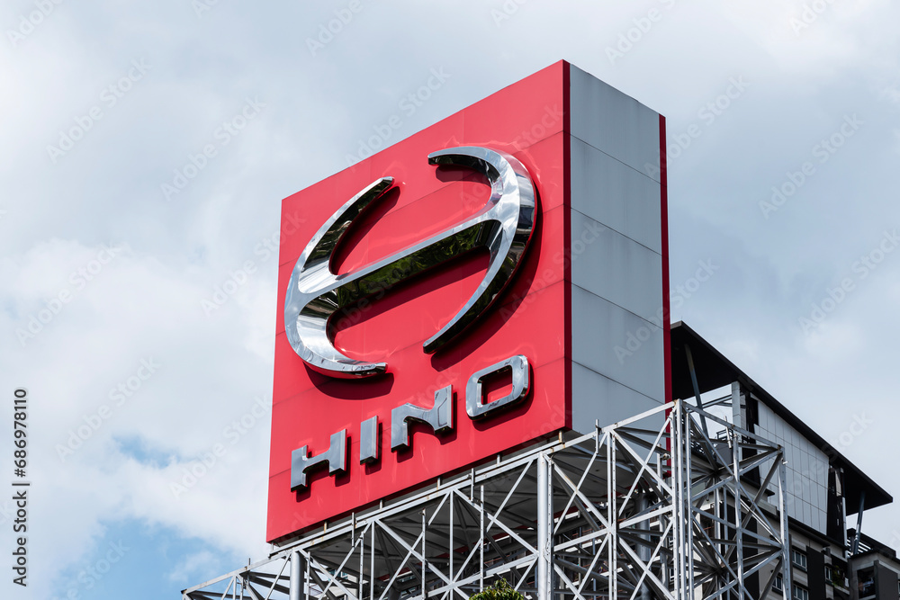 Pole billboard with logo HINO on blue sky background Stock Photo ...