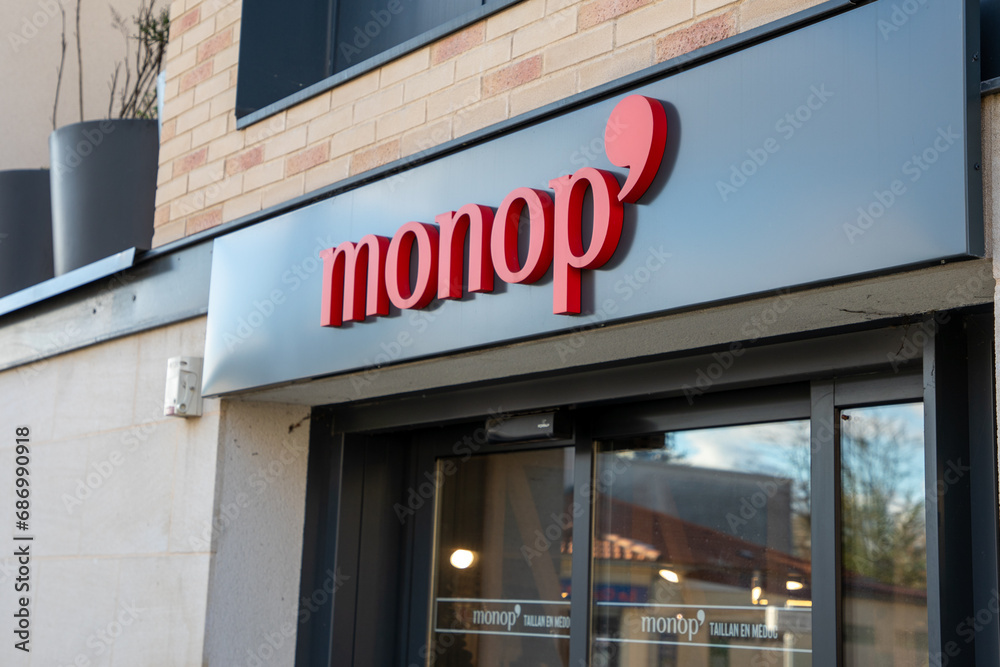 Monop' sign logo and text brand wall facade retail chain store wall ...